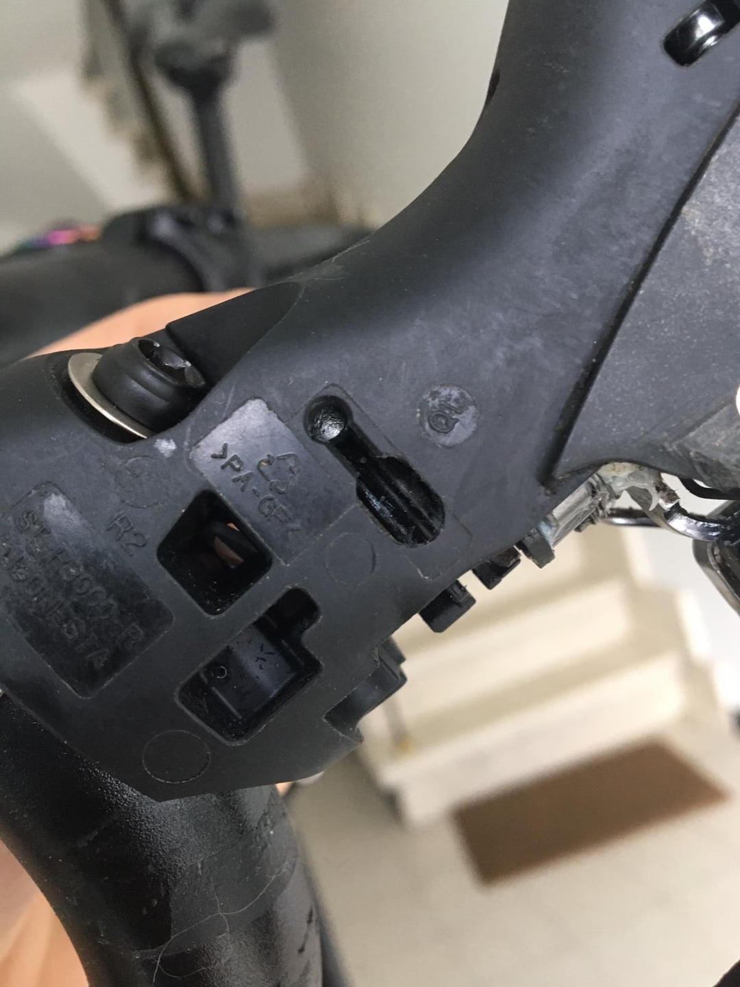 How screwed am I? My new rear shifting cable is stuck inside the hood ...